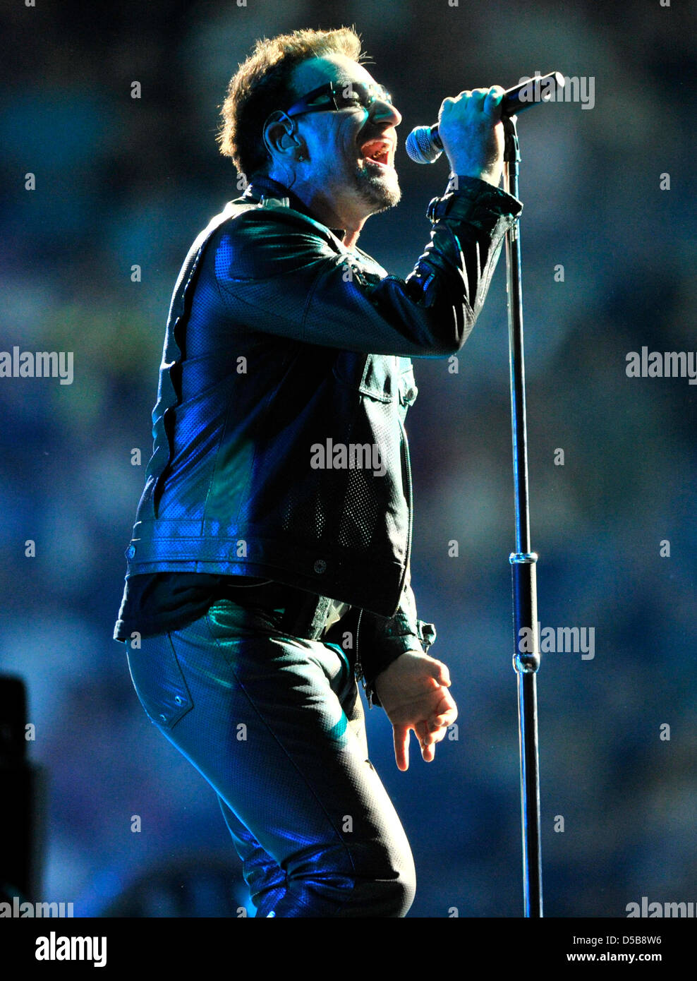 Lead singer Bono, of the Irish band U2, sings for 55.000 fans in the ...