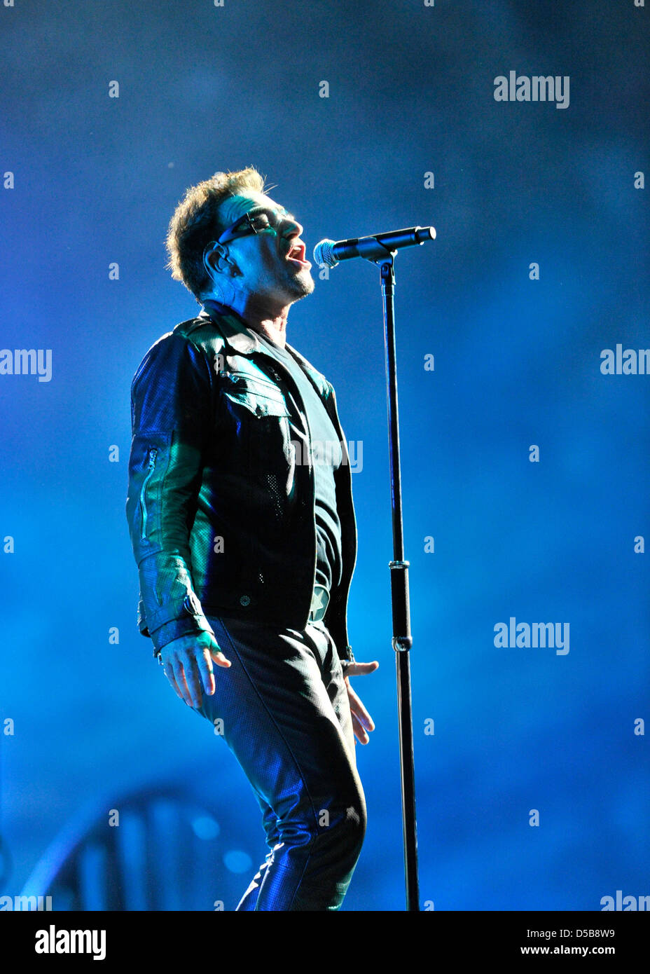 Frontman Bono, of the Irish band U2, sings for 55.000 fans in the ...