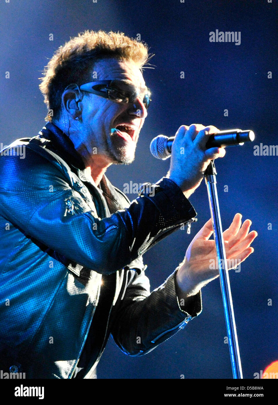 Frontman Bono, of the Irish band U2, sings for 55.000 fans in the ...