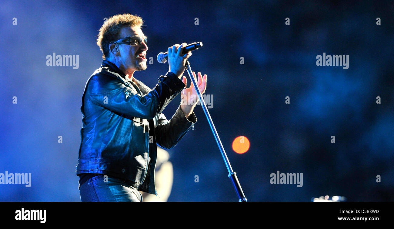 Frontman Bono, of the Irish band U2, sings for 55.000 fans in the ...