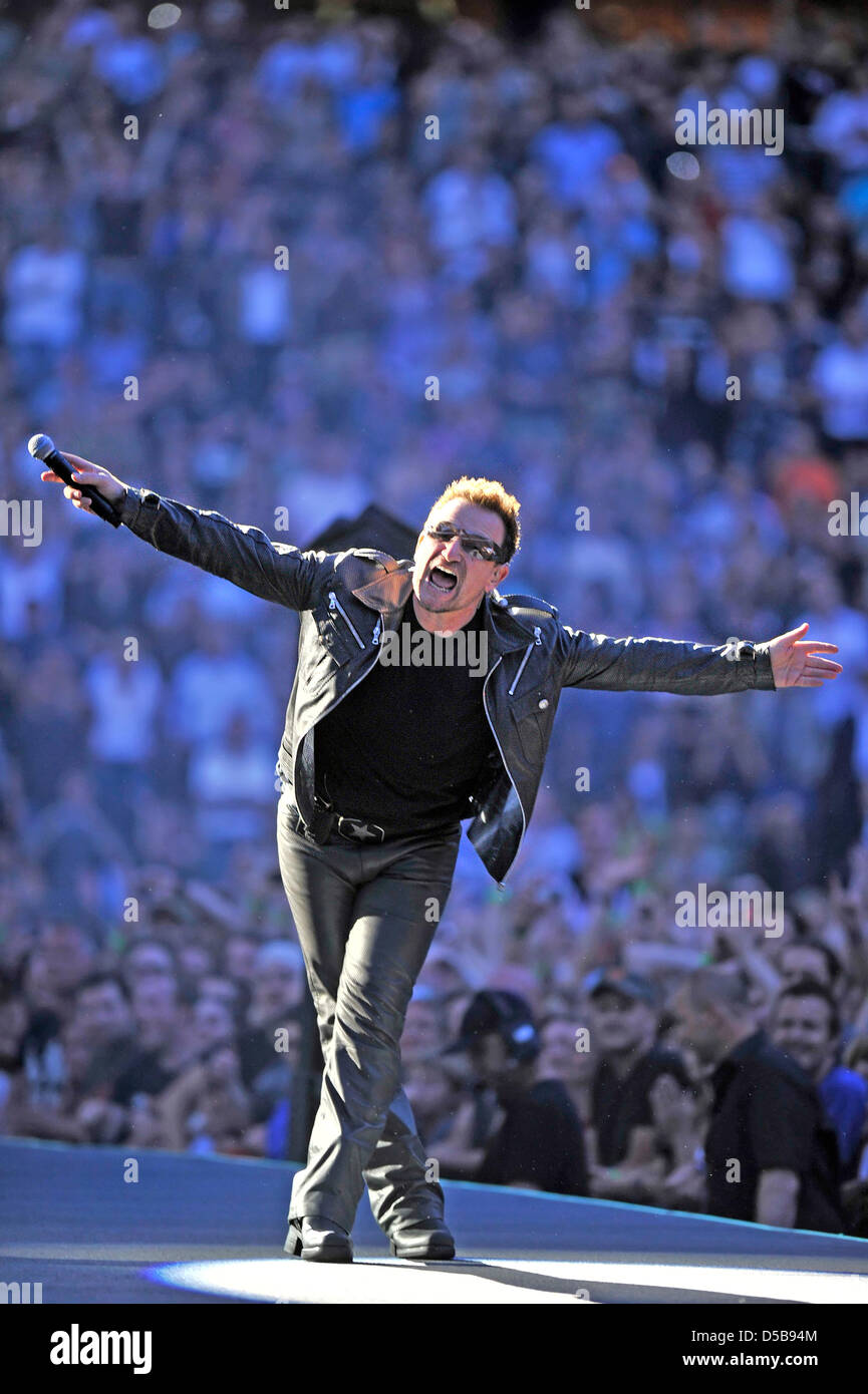 Frontman Bono, of the Irish band U2, sings for 55.000 fans in the ...