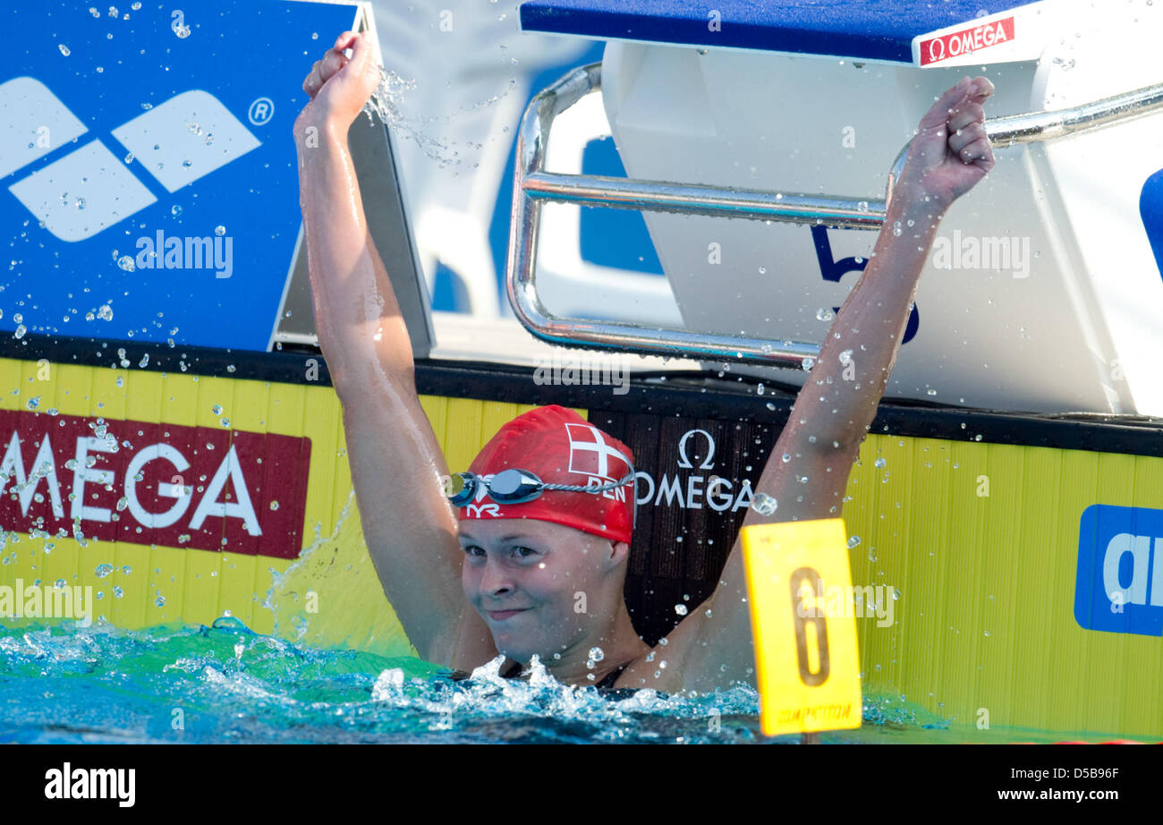Danish swimmer Lotte Friis smiles and cheers after the women's 800 ...