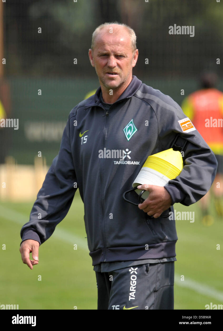 Werder Bremen's soccer coach Thomas Schaaf walks across the pitch ...
