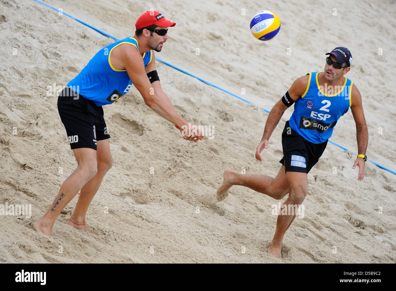 Spain's Inocencio Lario Carrillo (L) plays a ball while his teammate ...