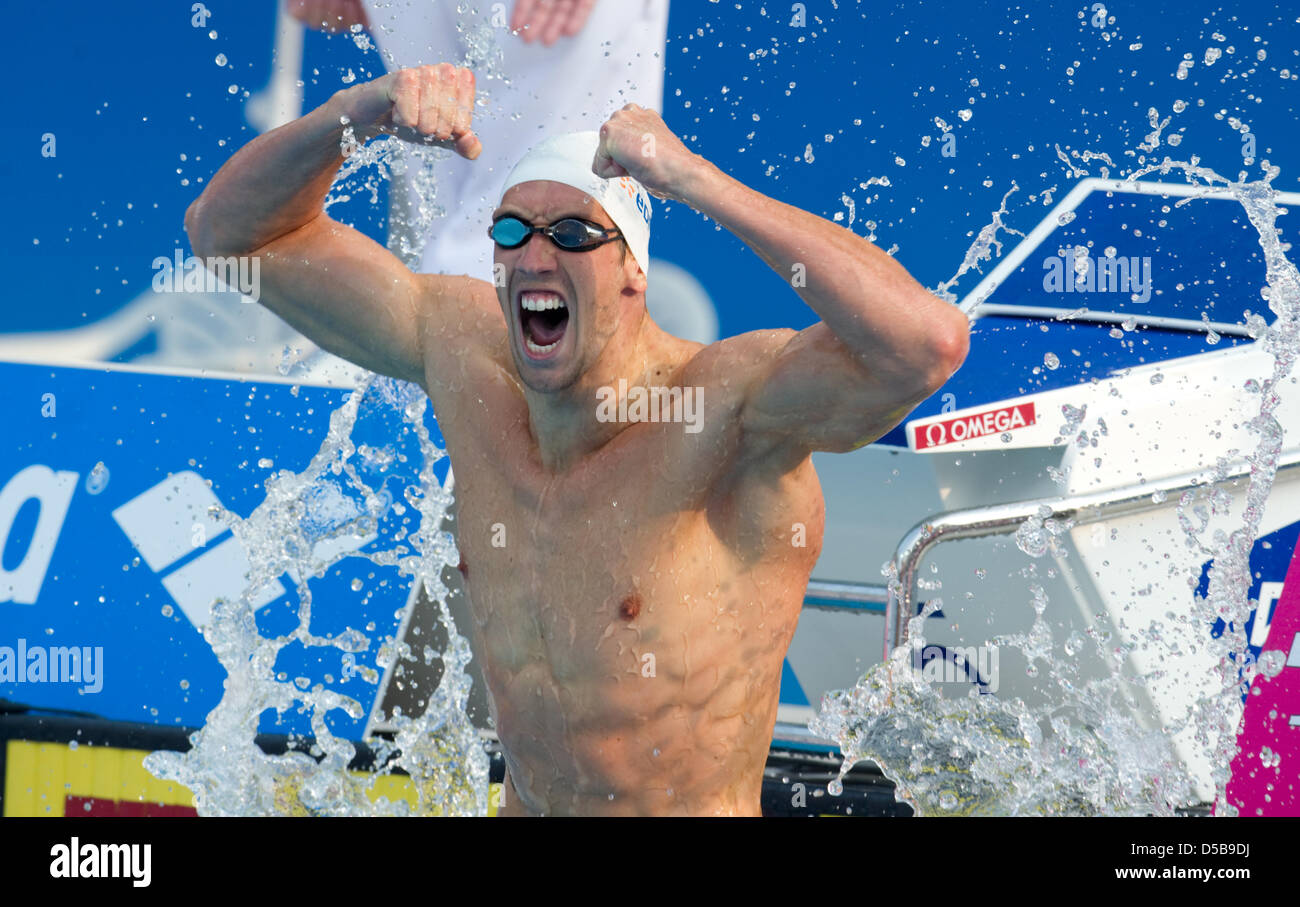 French swimmer Alain Bernard celebrates his gold medal in the men's 100 ...