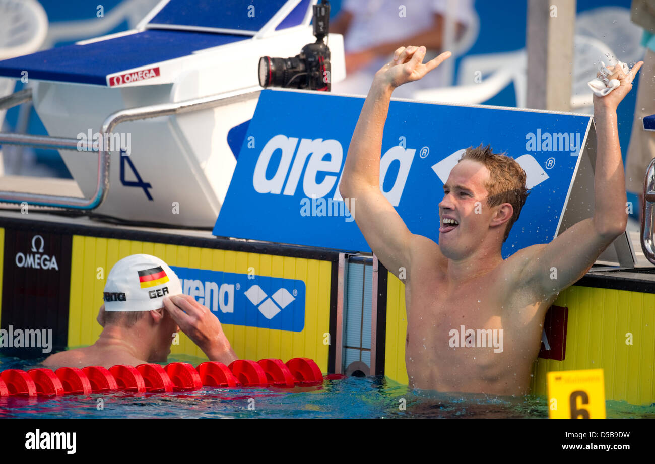 French swimmer Sebastien Rouault (R) celebrates his gold medal in the ...