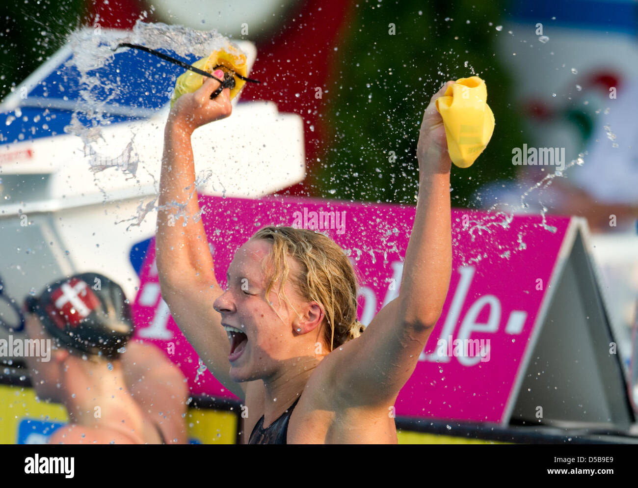 Swedish swimmer Sarah Sjoestroem celebrates her gold medal in the women ...
