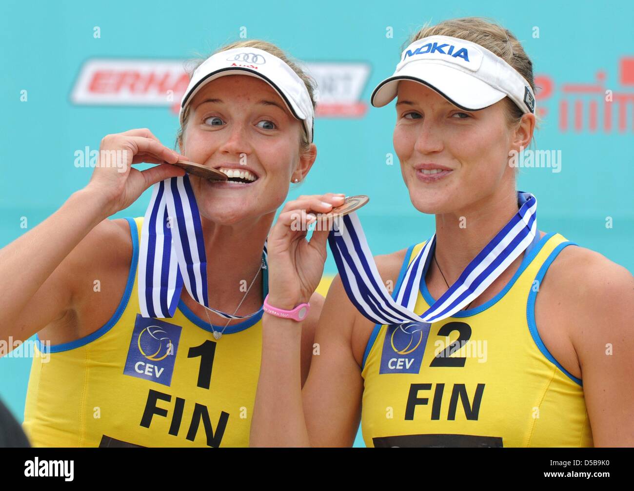 Finland's Erika (L) and Emilia Nystrom celebrate their third place at ...