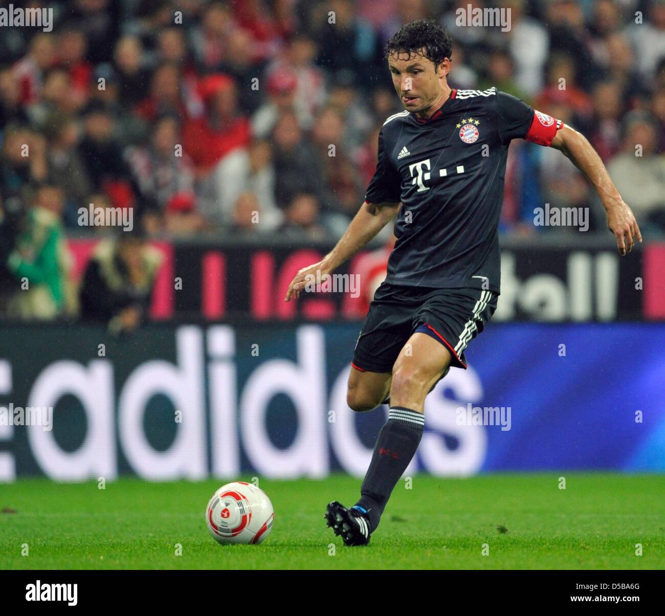 Bayern Munich's Mark van Bommel controls the ball during the friendly ...
