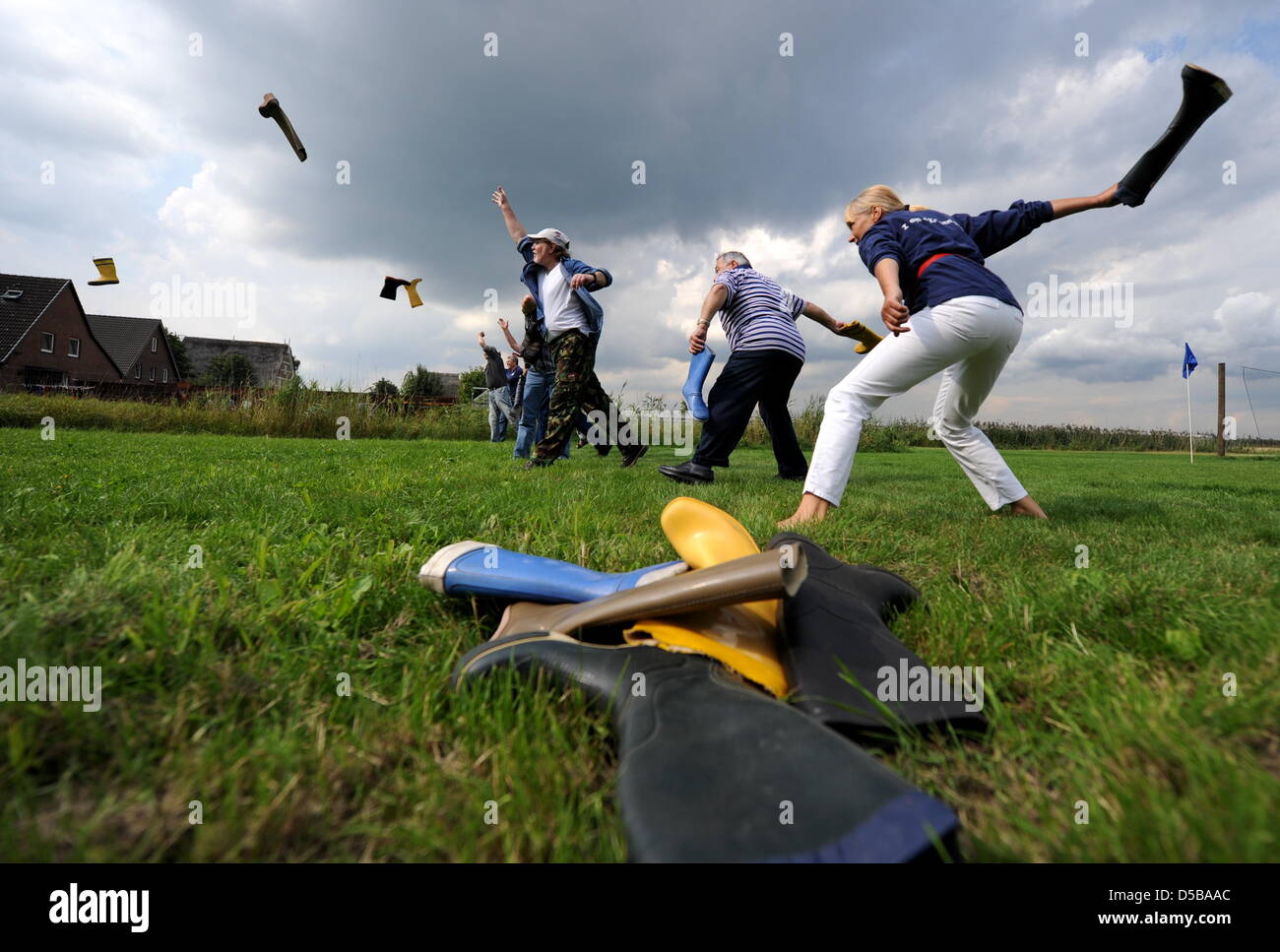 Seafarers compete in their traditional gumboots long throw in Hamburg ...
