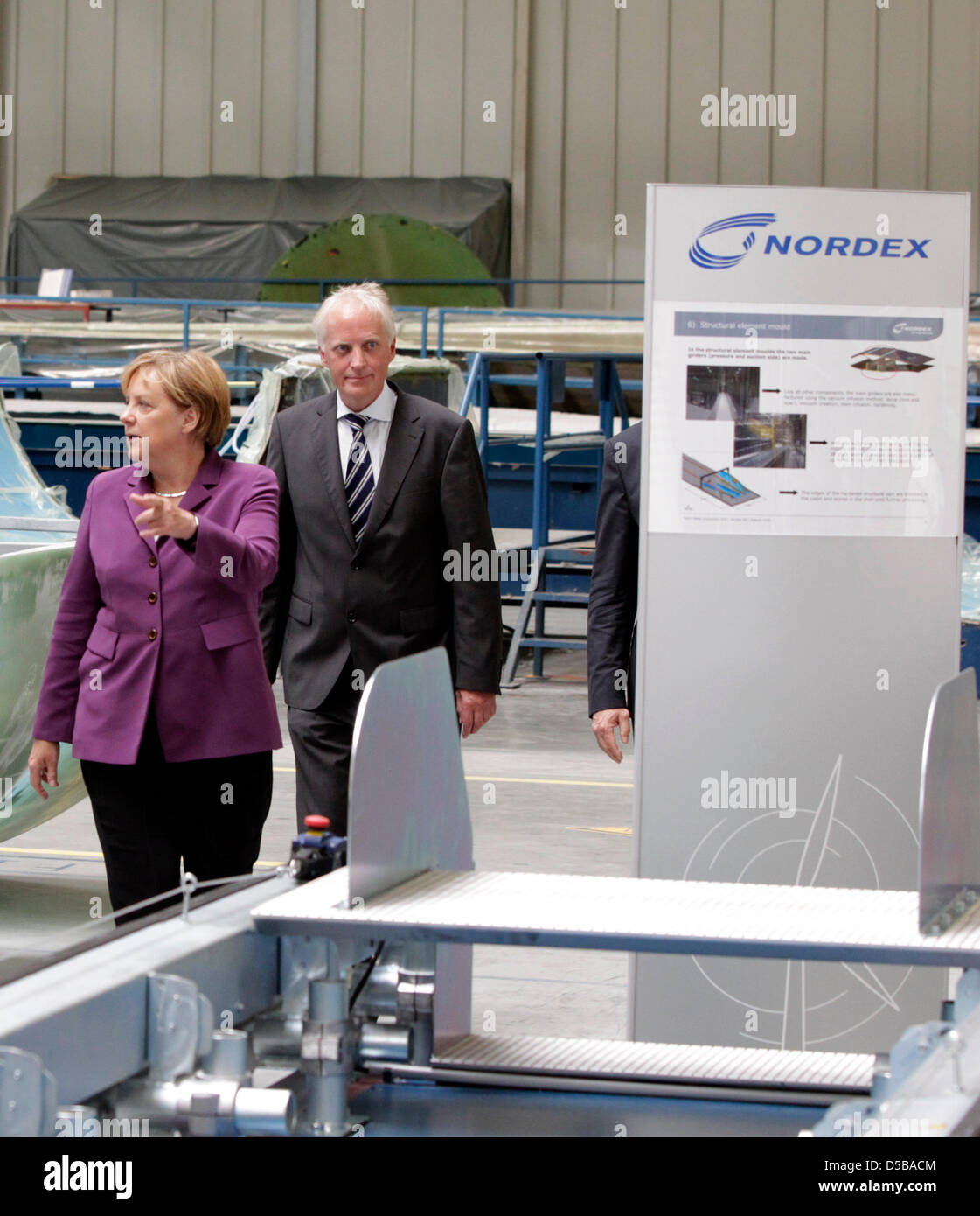 German Chancellor Angela Merkel and Thomas Richterich, CEO of wind ...