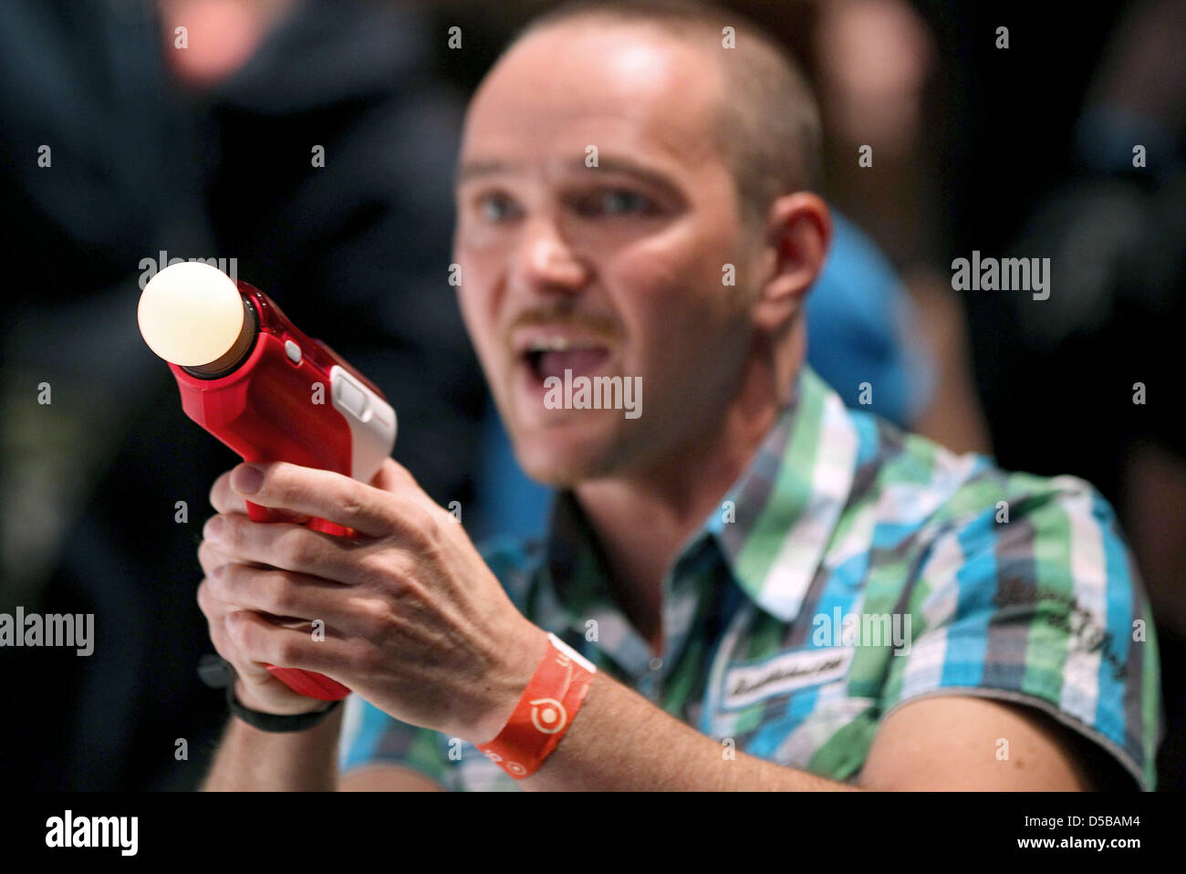 A visitor tries out a motion-controlled game at the Gamescom trade fair ...
