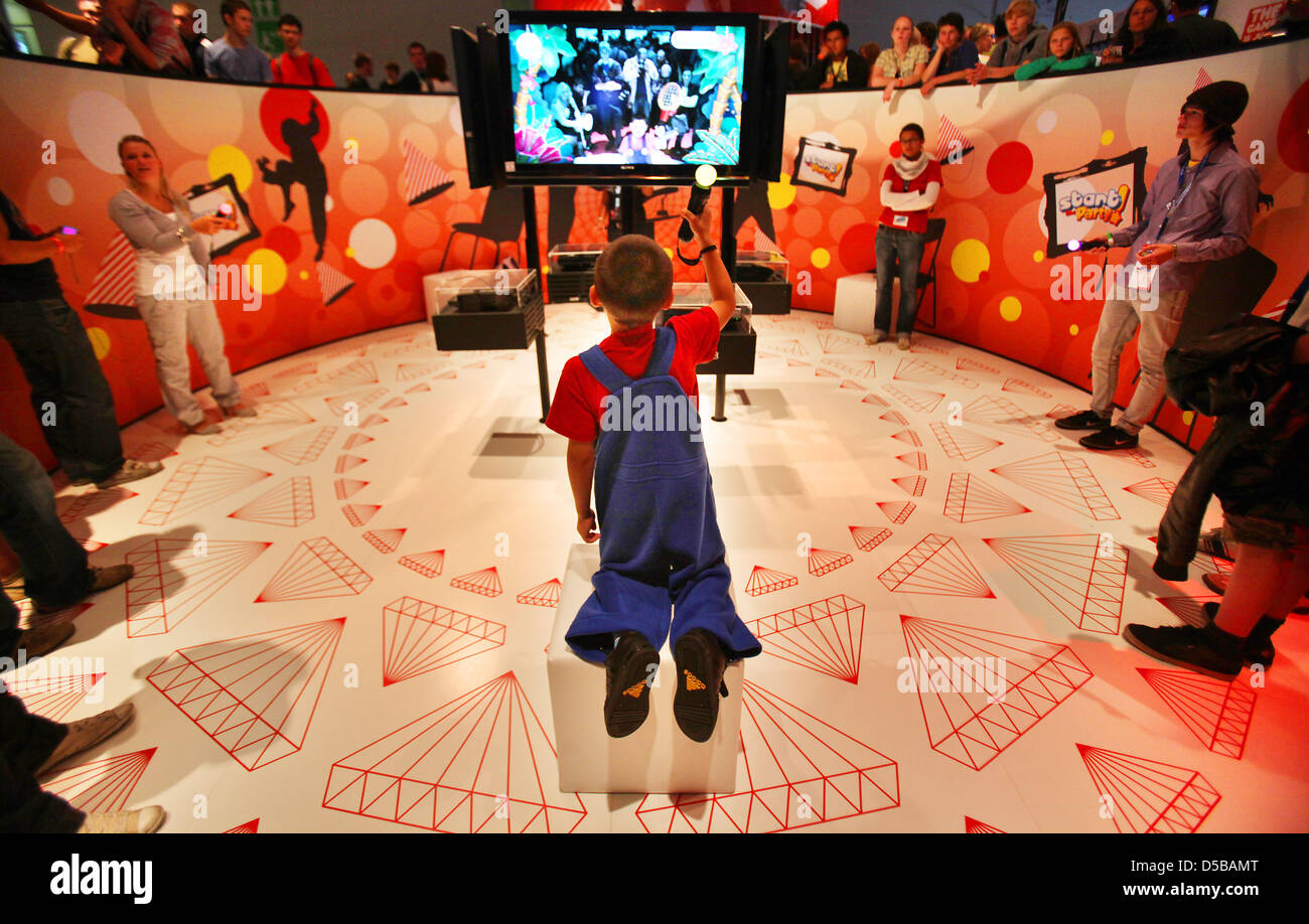 A visitor checks out a motion-controlled game at the Gamescom trade ...