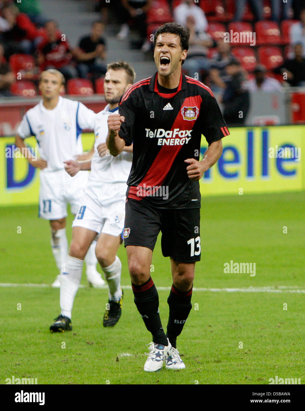 Leverkusen's Michael Ballack celebrating his conversion of a penalty to ...