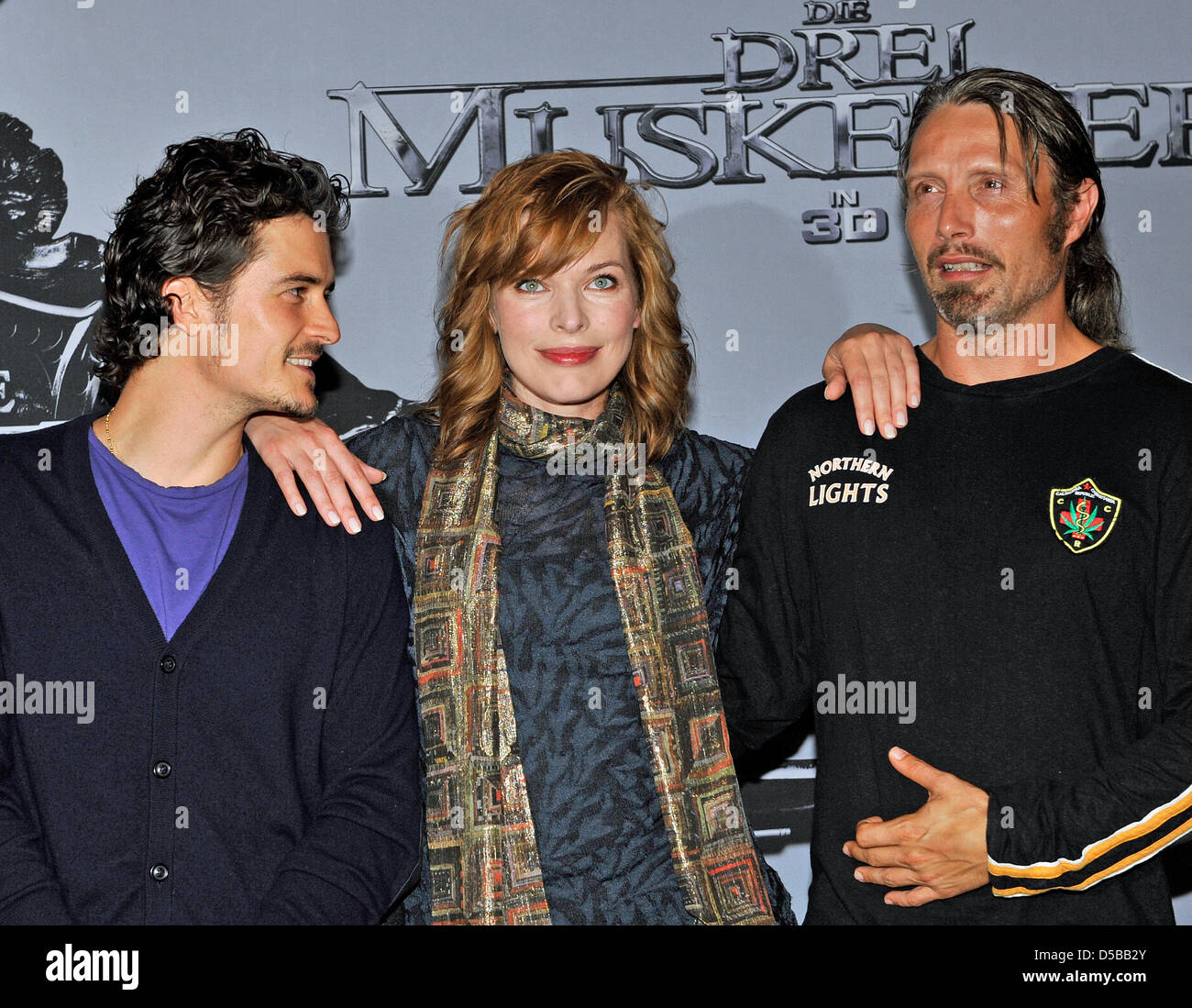 (L to R) Actors Orlando Bloom, Milla Jovovich and Mads Mikkelsen pose ...