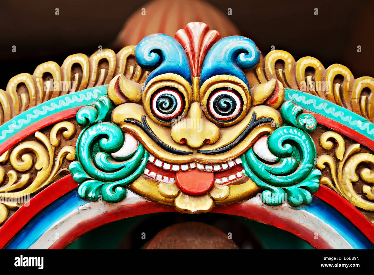 Hindu face on the temple Stock Photo - Alamy