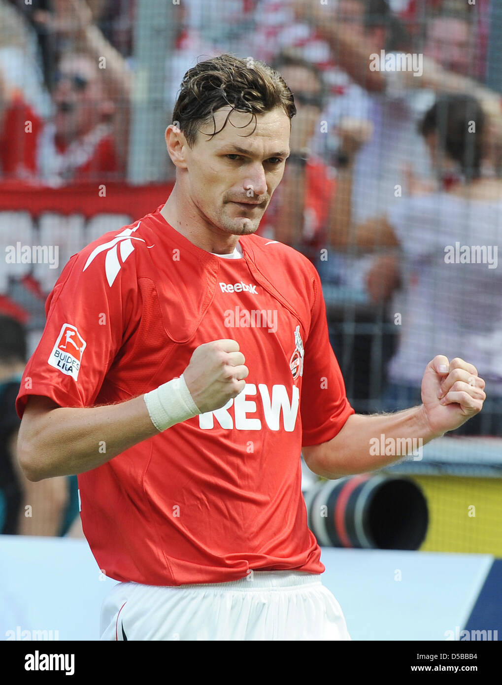 Cologne's Milivoje Novakovic celebrates his 1-0 during German ...
