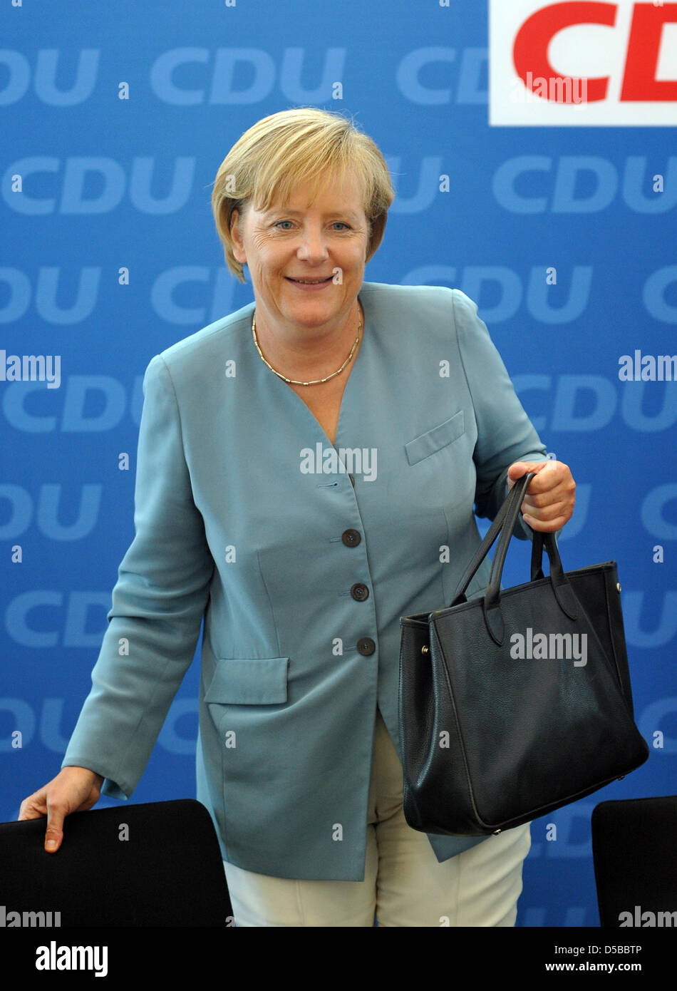 German Chancellor Angela Merkel gestures during a meeting of her ...