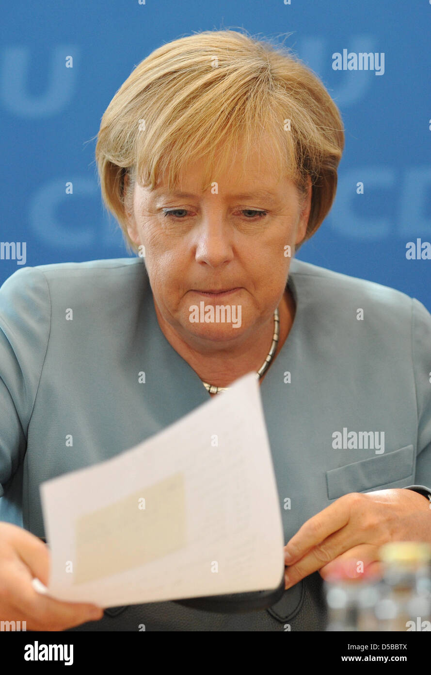 German Chancellor Angela Merkel gestures during a meeting of her ...