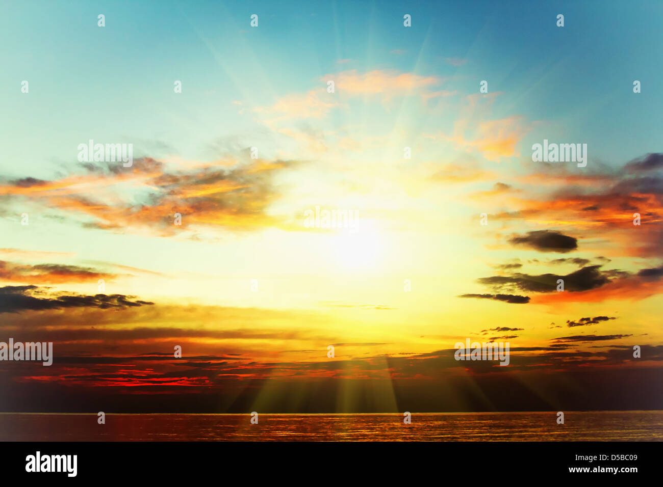 Full power sunset in the sea Stock Photo - Alamy