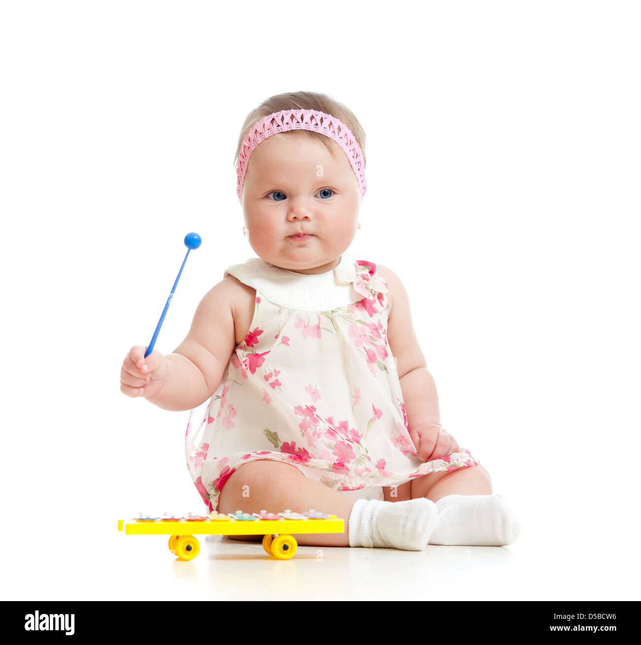 little girl baby playing with musical toy Stock Photo - Alamy