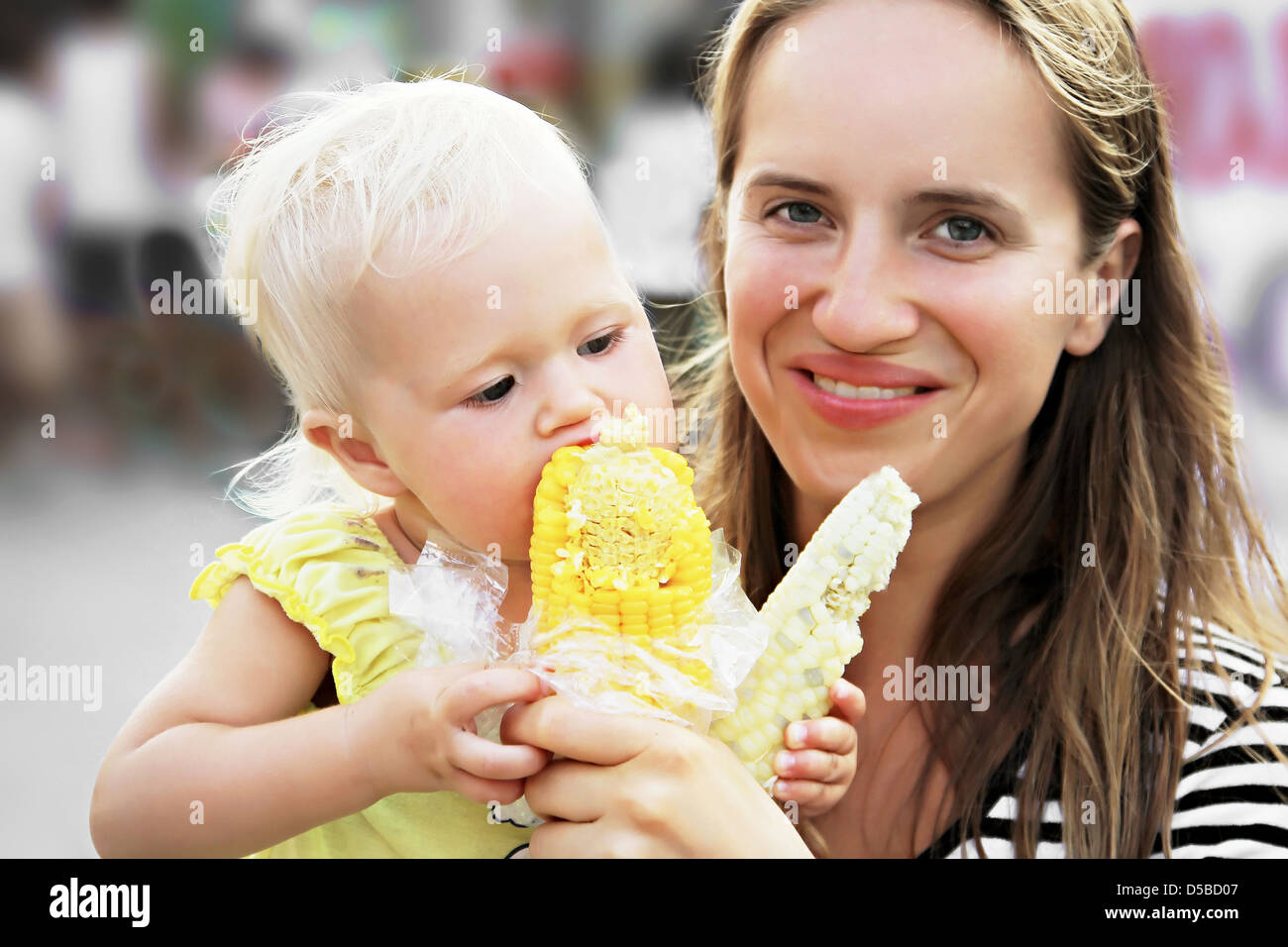 Baby eating the ripe corn Stock Photo - Alamy