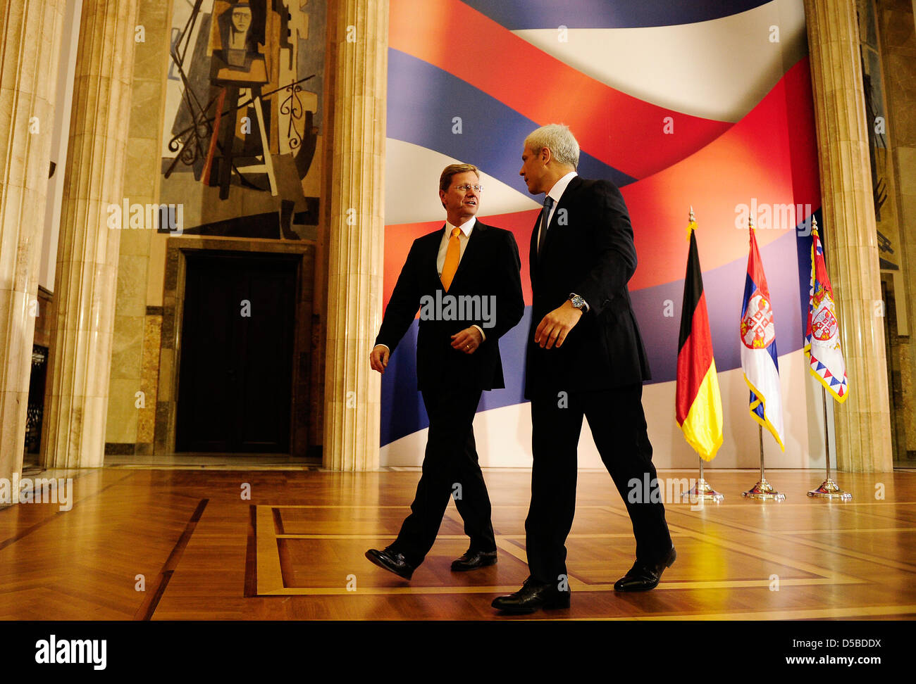 Serbian President Boris Tadic (R) greets German Foreign Minister Guido ...