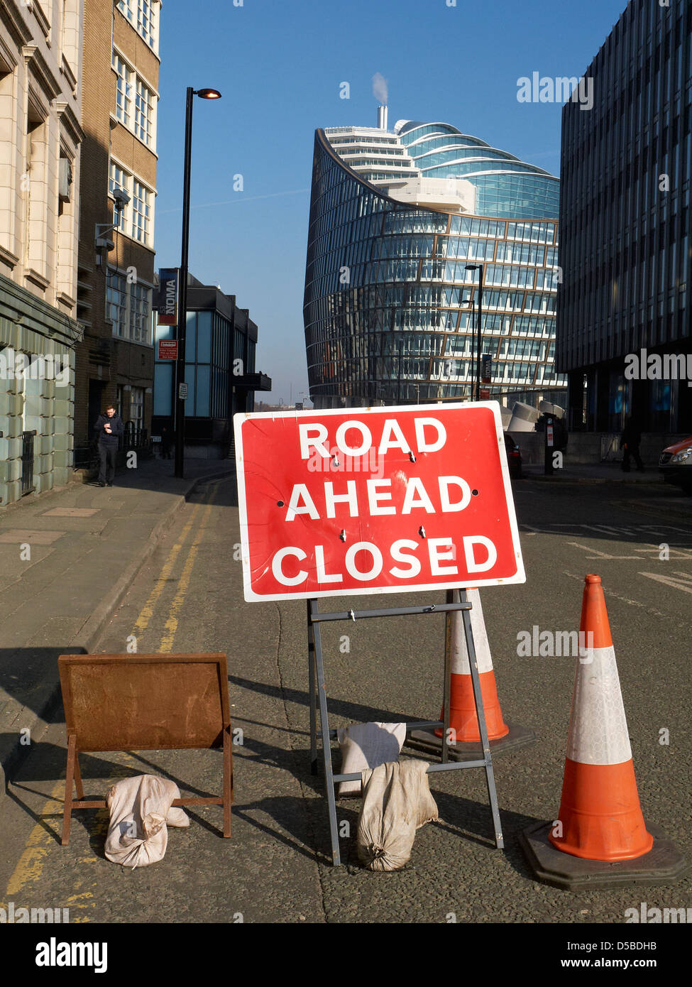Road closure sign with Noma building in Manchester UK Stock Photo - Alamy