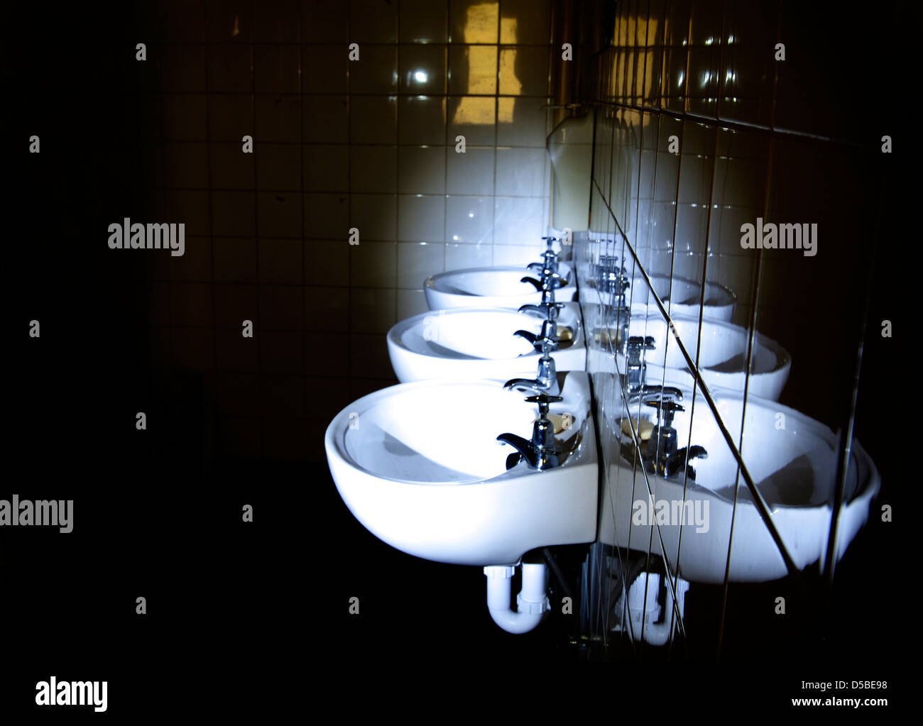 Public toilet sinks Stock Photo - Alamy