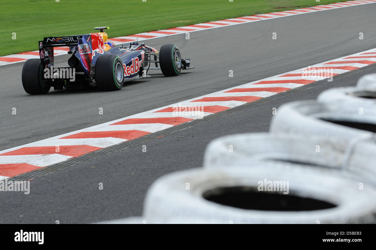 Australian formula one pilot Mark Webber steers his Red Bull racing car ...