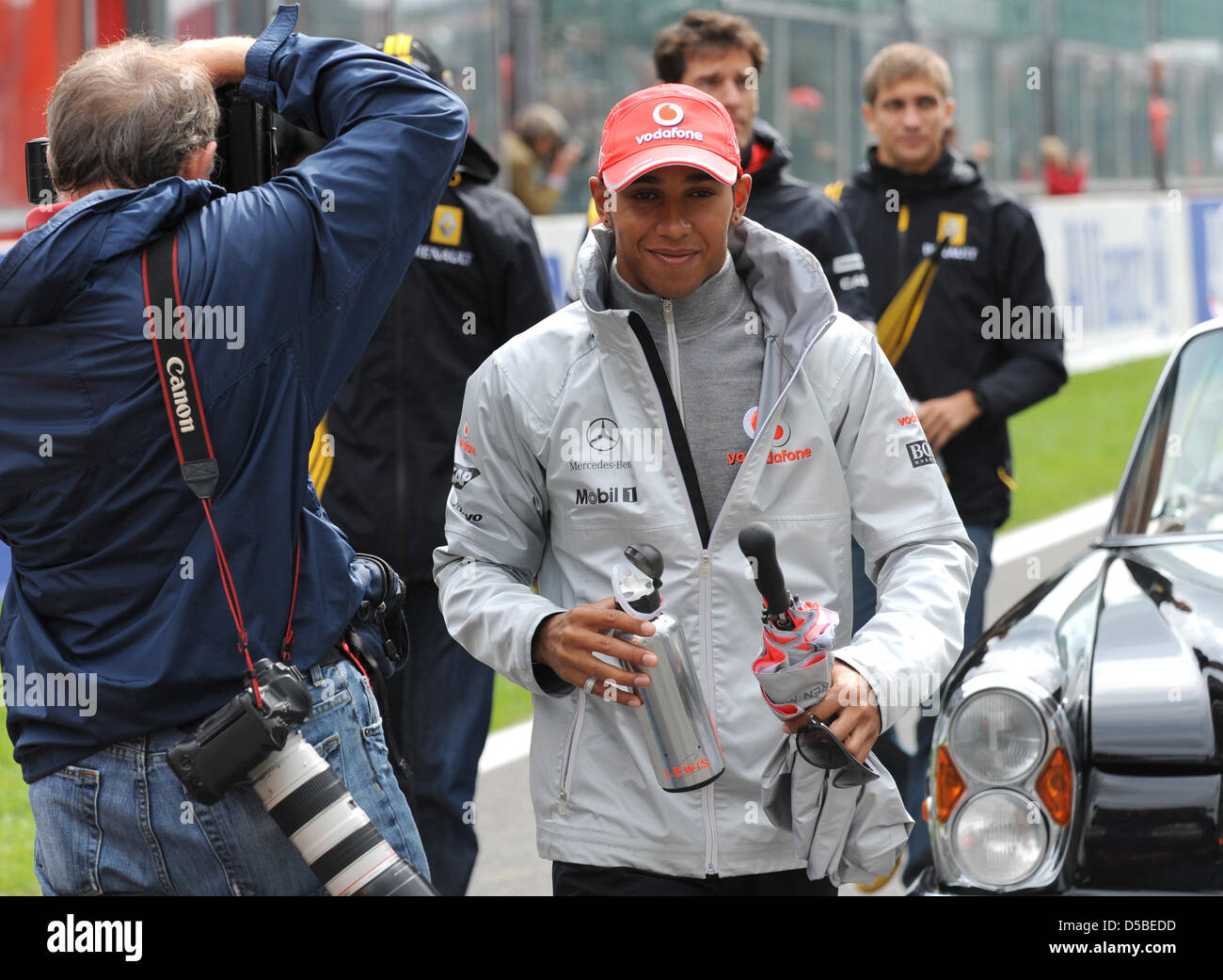 British formula one pilot Lewis Hamilton (C) arrives for the drivers ...