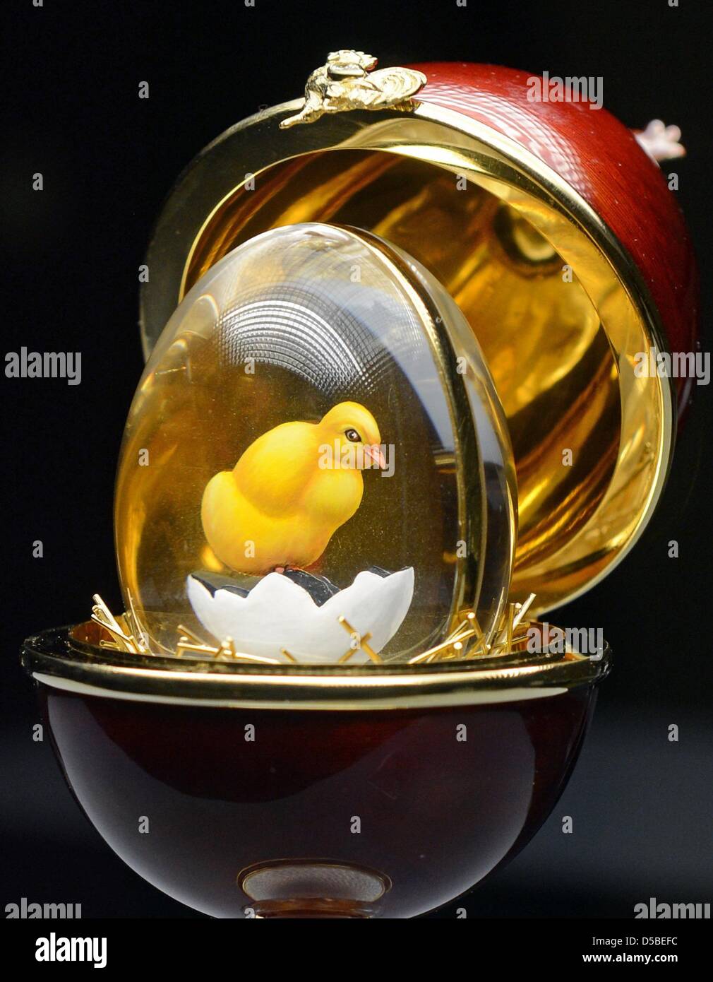 A chick sits in a magnificant egg which is on display at the new ...
