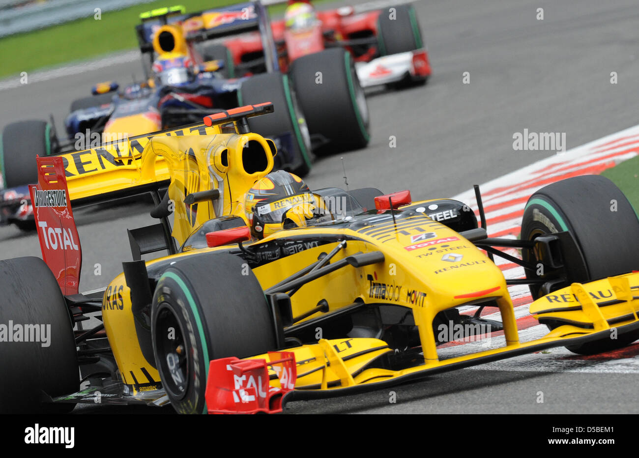 Polish formula one driver Robert Kubica (front) of Team Renault races ...