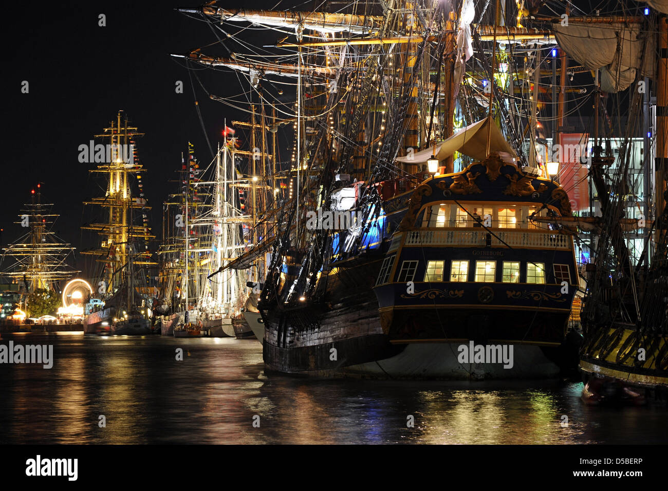AT night, sailships are illuminated by lights during the 'Sail 2010 ...