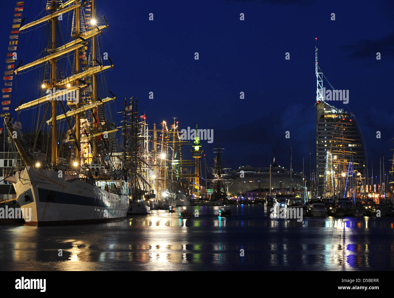 AT night, sailships are illuminated by lights during the 'Sail 2010 ...