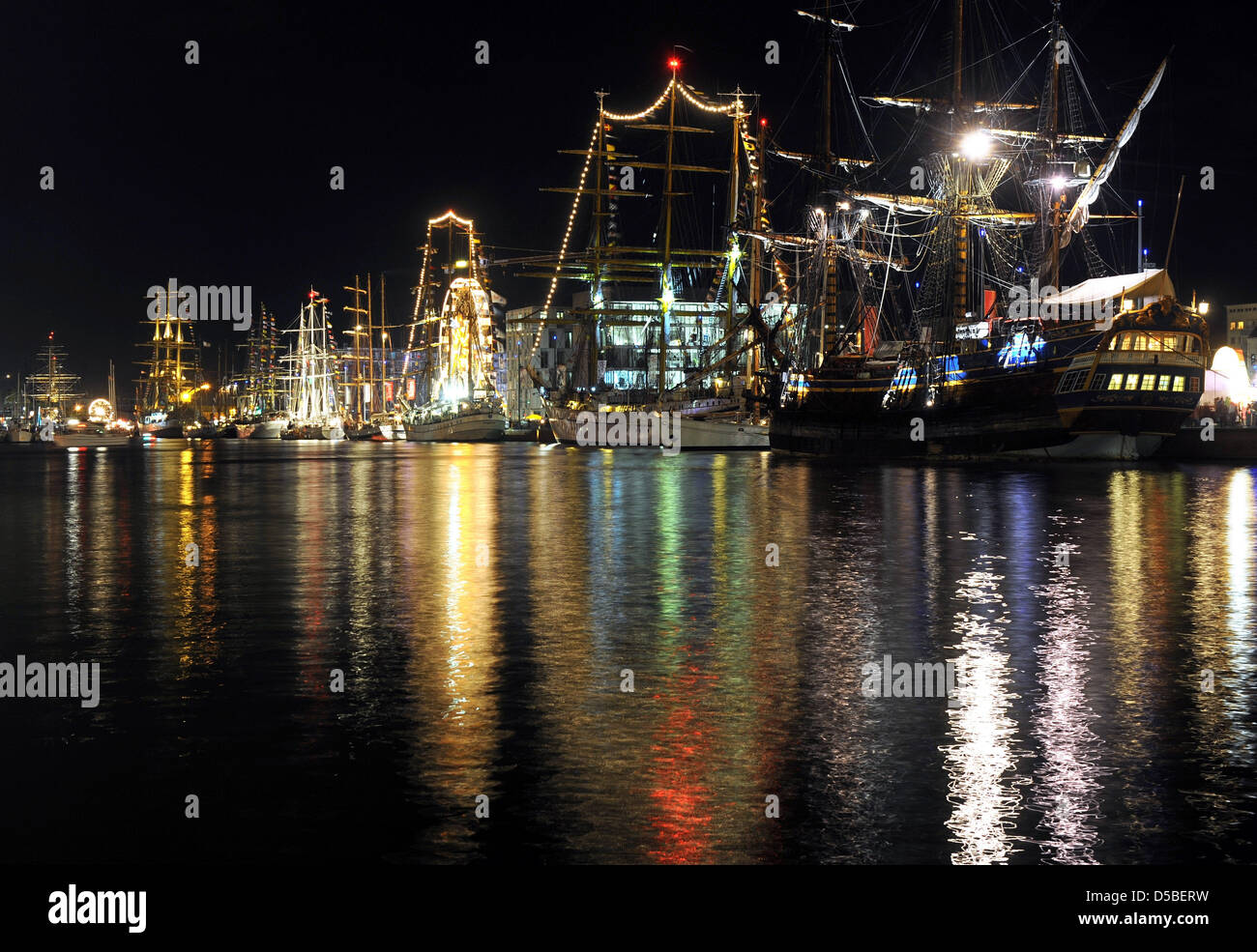 AT night, sailships are illuminated by lights during the 'Sail 2010 ...