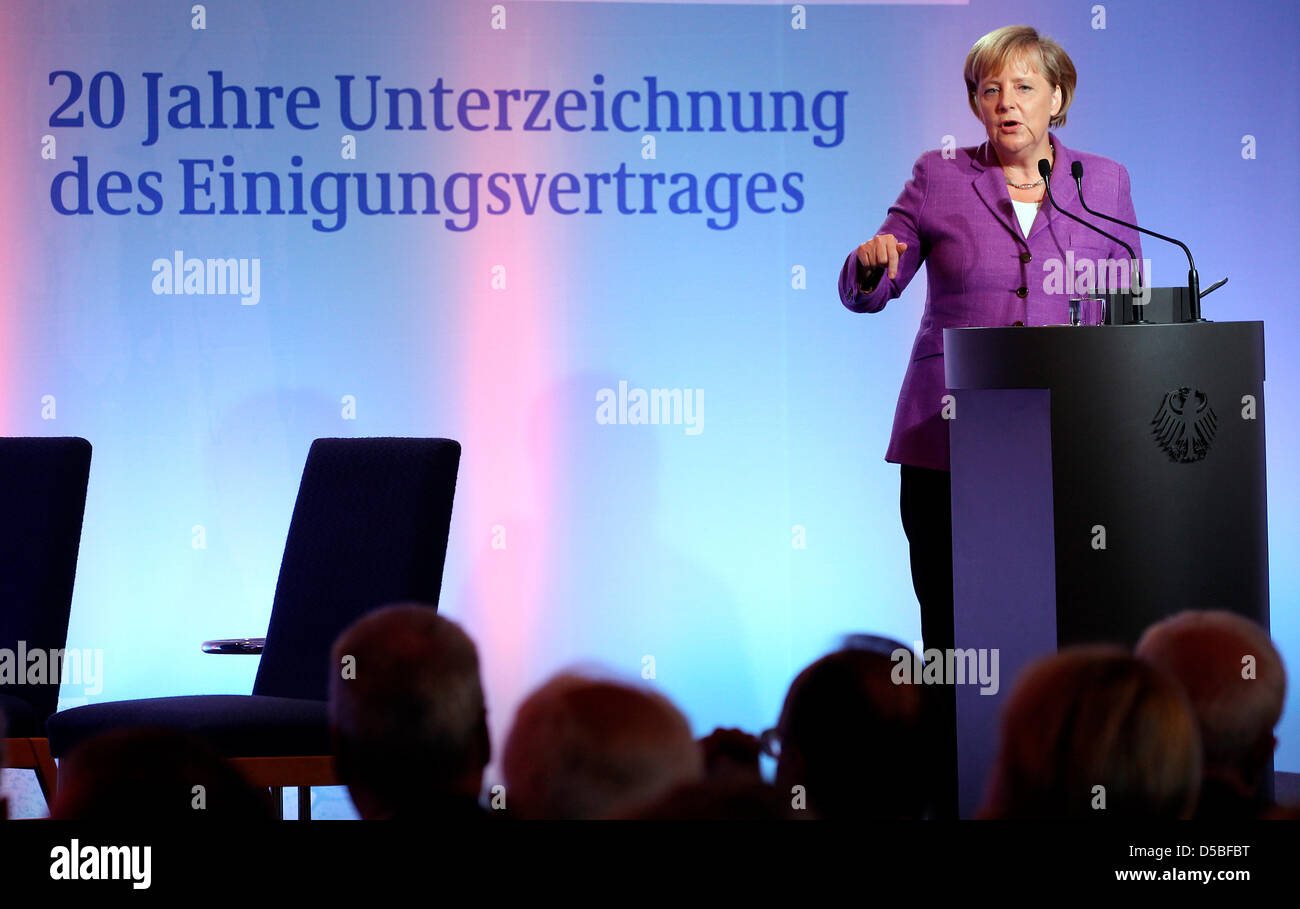 German Chancellor Angela Merkel delivers a speech during a ceremonial ...