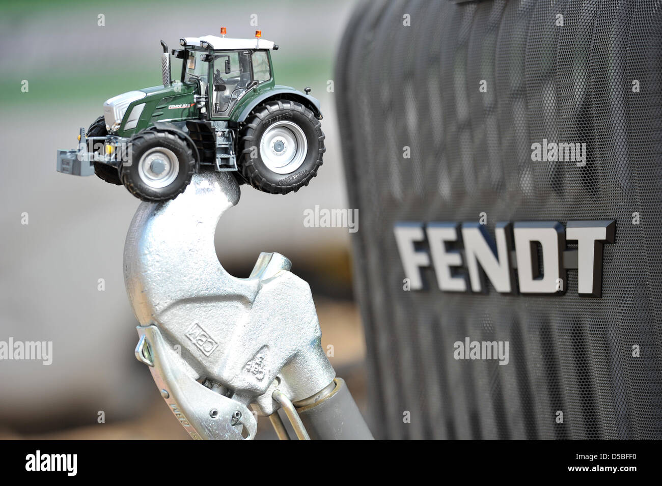 A Fendt model tractor on an actual Fendt vehicle, captured during a ...