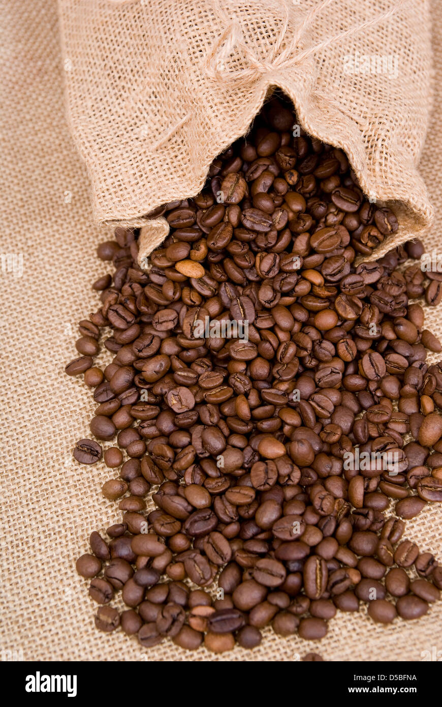 spilled grains of coffee with bag Stock Photo - Alamy