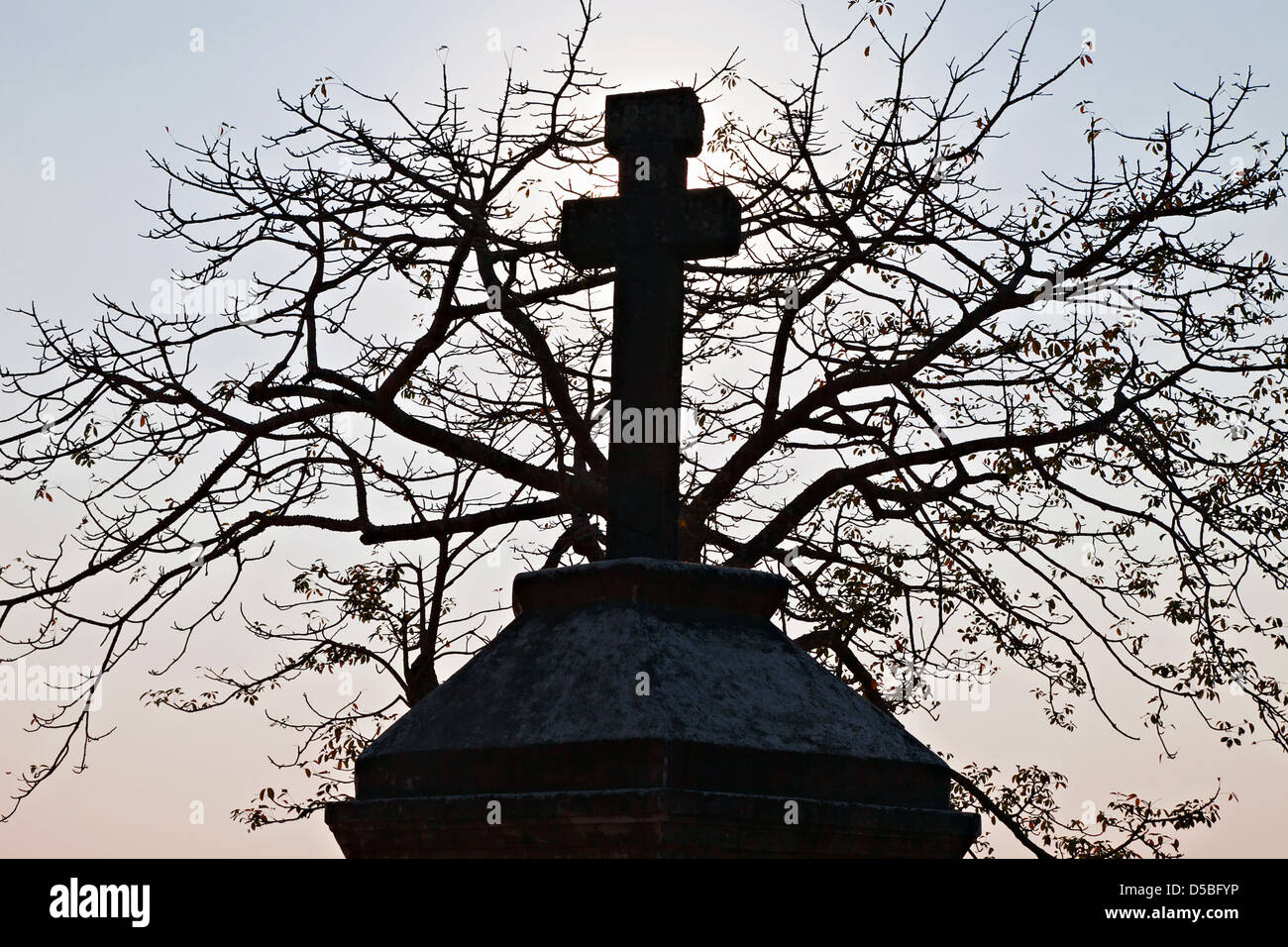 Cross monument on the tree background Stock Photo - Alamy