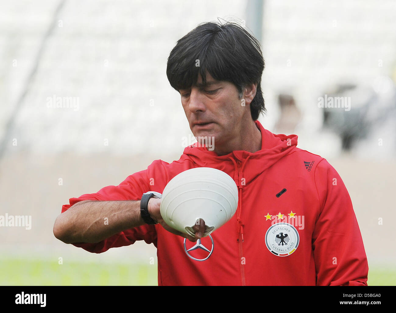 German National Coach Joachim Loew checks his watch during the final ...