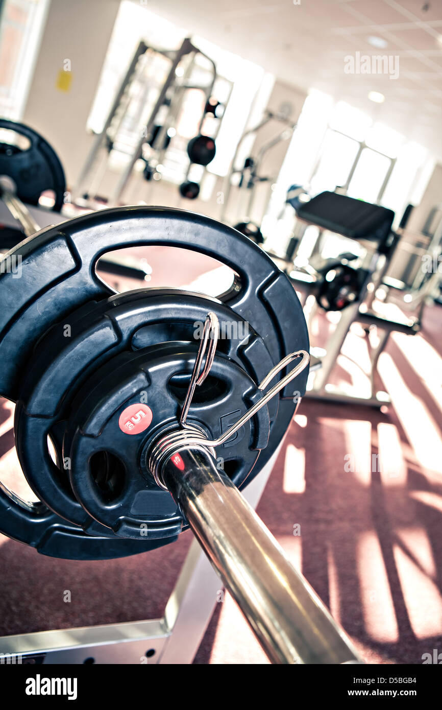diverse equipment and machines at the gym room Stock Photo - Alamy