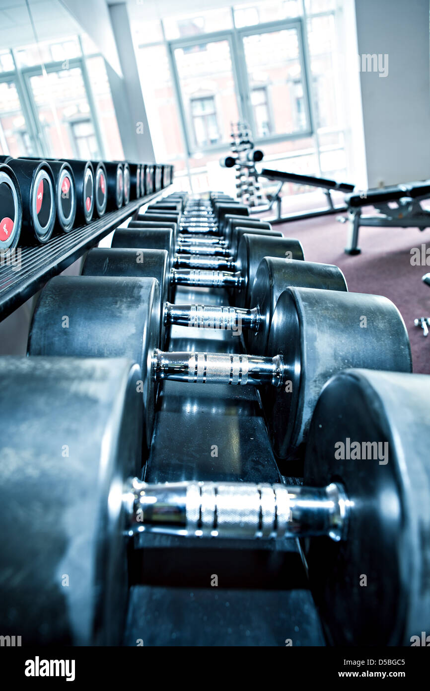 diverse equipment and machines at the gym room Stock Photo - Alamy