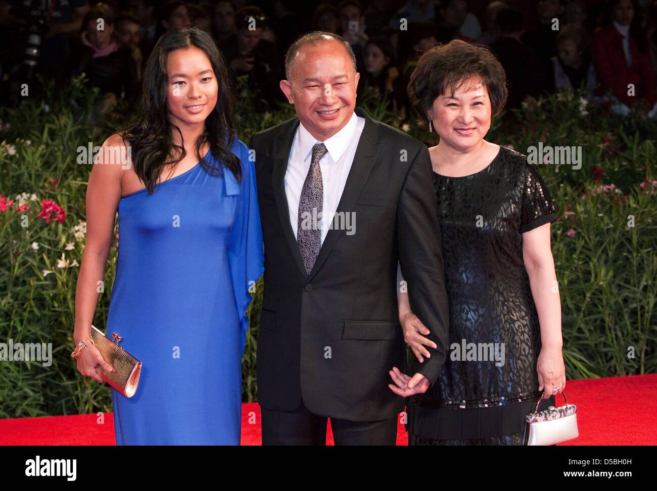 (L-R) Actress Angeles Woo, her father and director John Woo and his ...