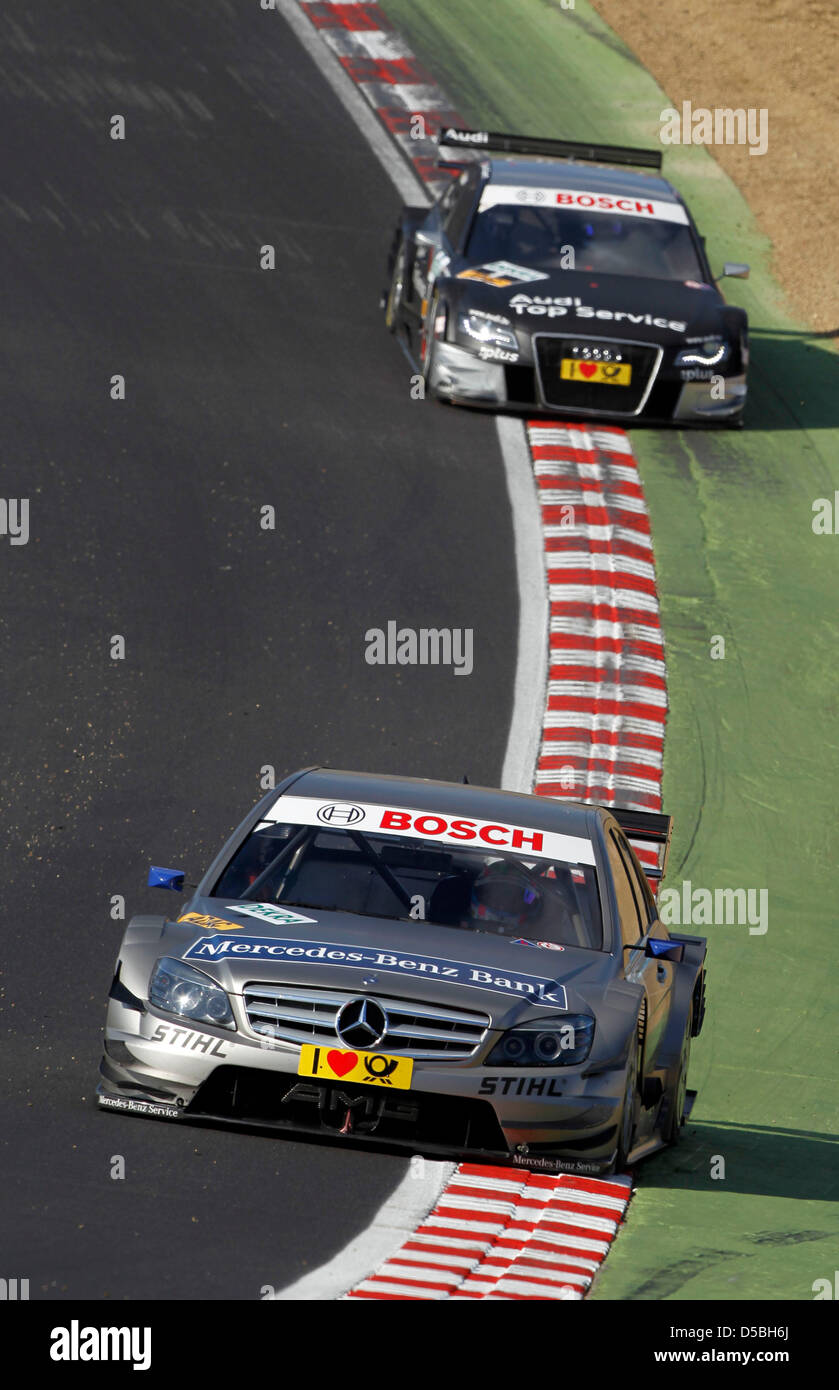 Canadian driver Bruno Spengler of AMG Mercedes (front) and German ...