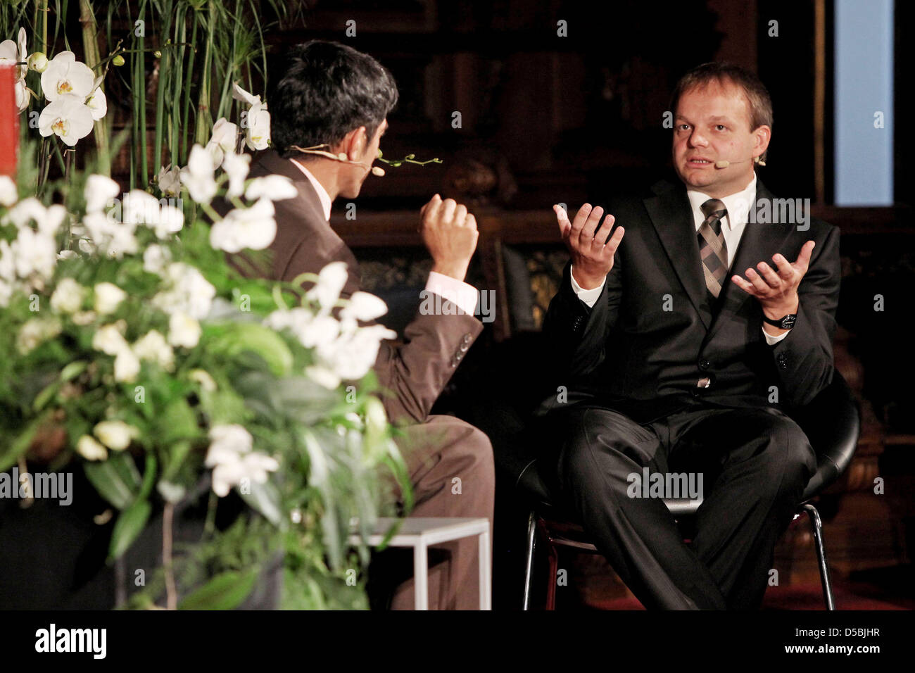 German science journalist and TV host Ranga Yogeshwar (L) interviews ...