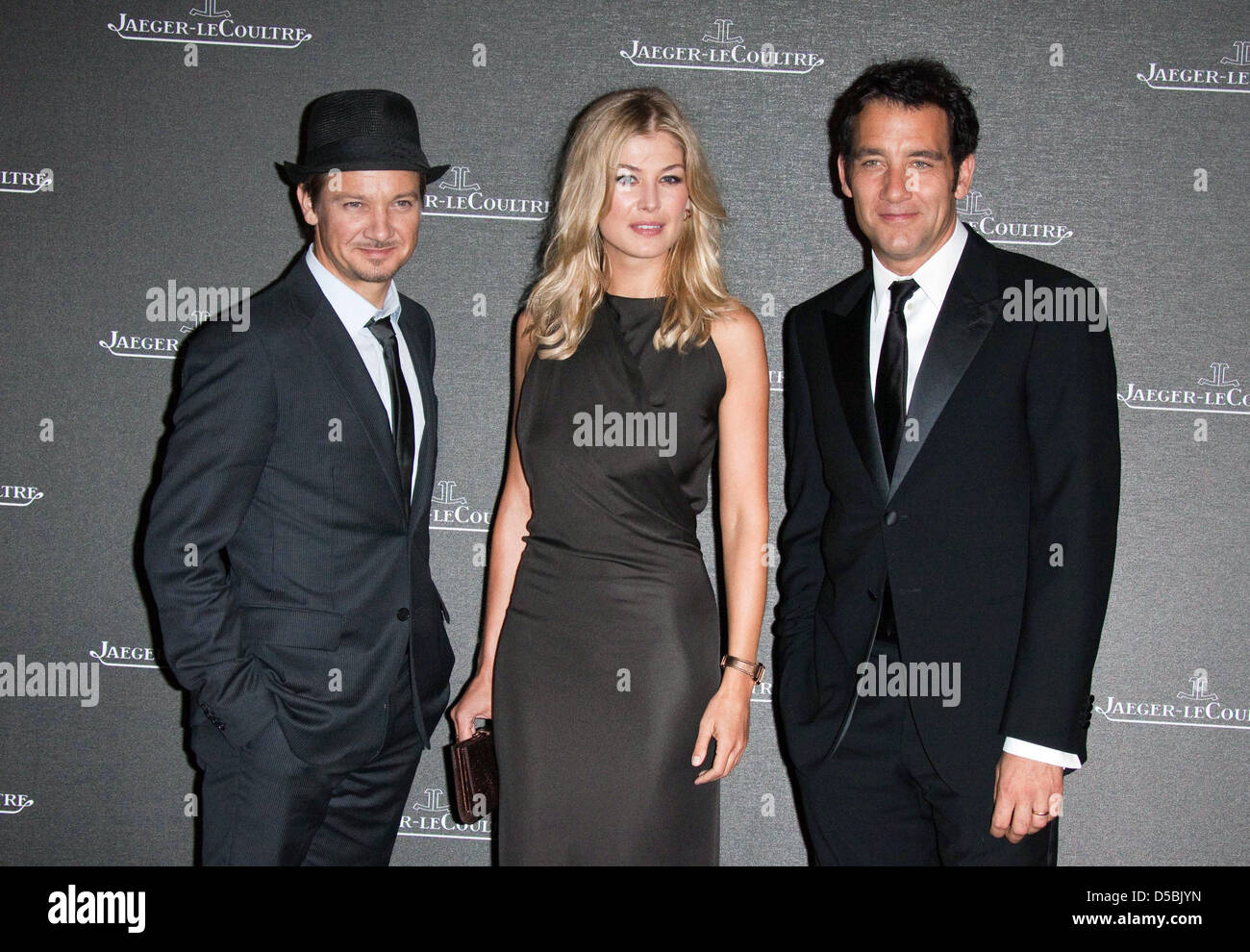Actors Jeremy Renner (L-R), Rosamund Pike and Clive Owen attend a ... Actors Jeremy Renner (L-R), Rosamund Pike and Clive Owen attend a ...
