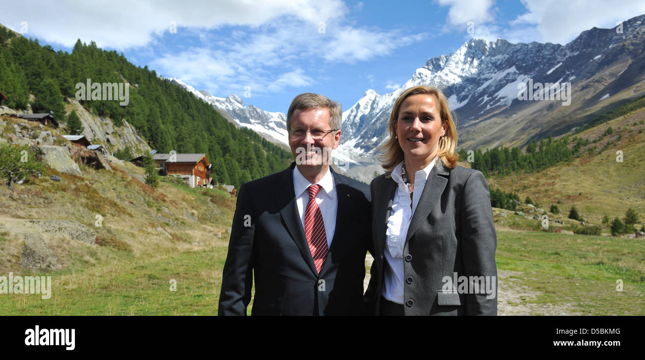 German Federal President Christian Wulff and his wife Bettina (R) smile ...