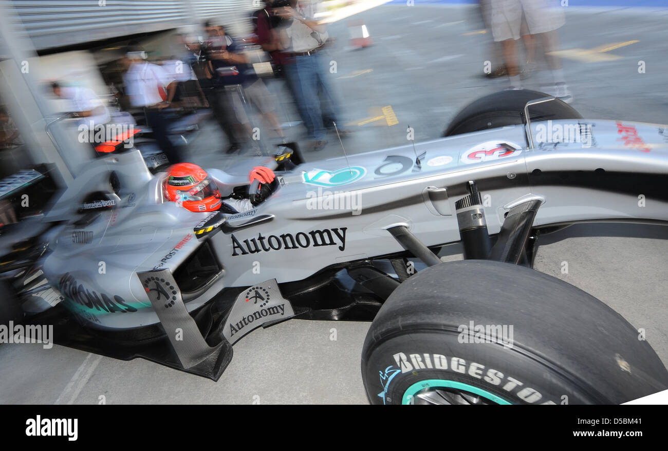 German driver Michael Schumacher of Mercedes GP drives out of his pit ...