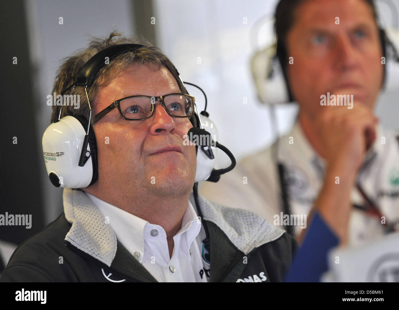 Mercedes-Benz motorsport president Norbert Haug watches the first ...